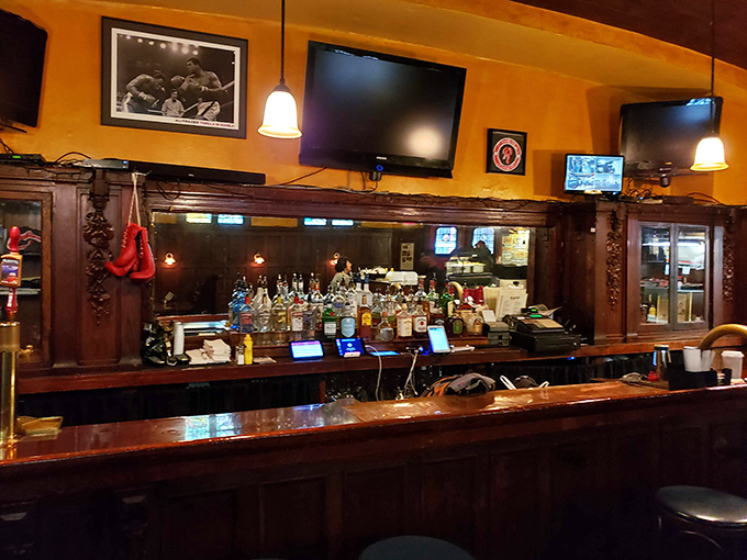 A bar that's seen it all, from celebrations to consolations. Boxing memorabilia watches over patrons while bartenders pour liquid courage and comfort.