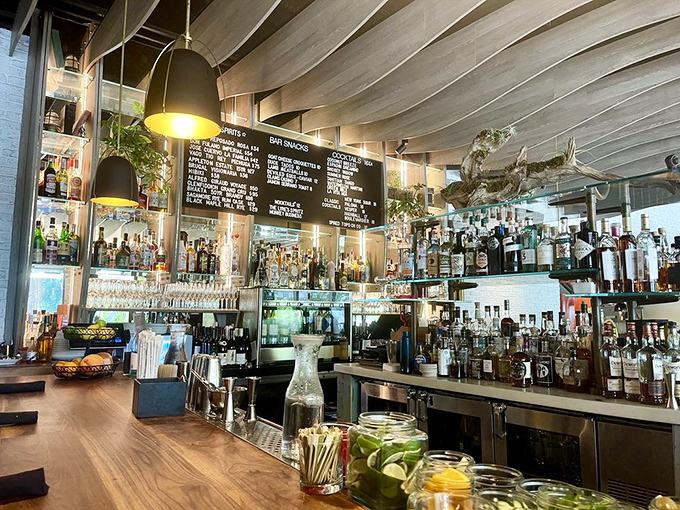 A bar stocked so beautifully it could make a teetotaler reconsider. Fresh citrus waiting to transform ordinary spirits into extraordinary memories.