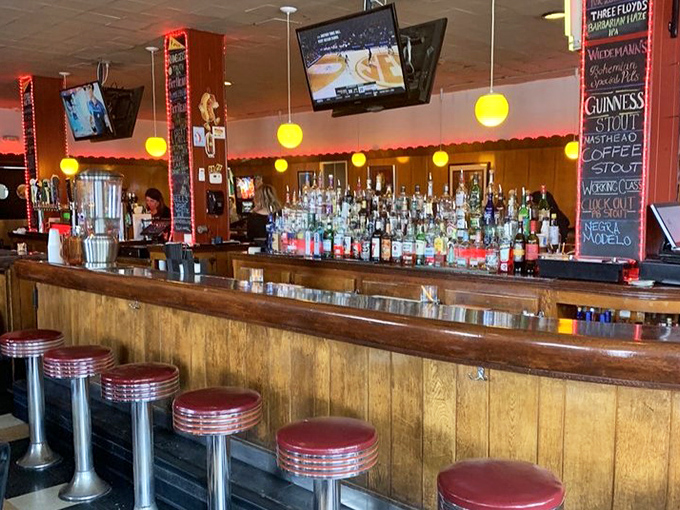 The bar gleams with promise, classic red stools inviting you to perch and ponder life's important questions&mdash;like whether to try the Guinness or local craft IPA.