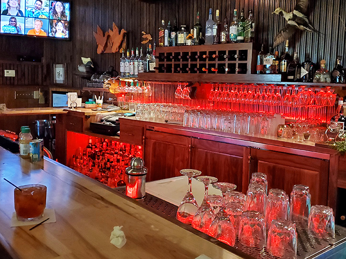 The bar glows red like the beating heart of the establishment. Those glasses stand ready for whatever life event you're celebrating &ndash; or escaping.