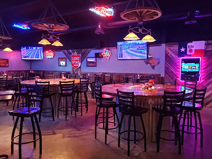 The bar area glows with neon signs and Texas pride, where conversations flow as freely as the beverages.
