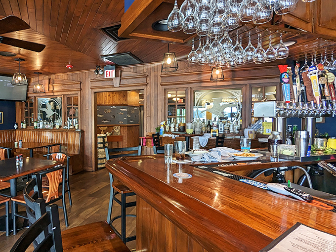 Wooden beams, wine glasses hanging like crystal stalactites, and a bar that invites you to pull up a stool and stay awhile. 