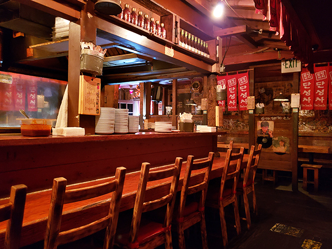 The bar counter offers front-row seats to culinary theater. Watching skilled hands prepare dish after dish becomes as mesmerizing as the flavor bombs they create.