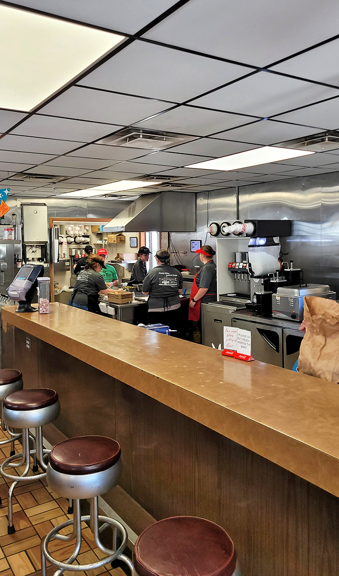 The kitchen choreography is mesmerizing&mdash;decades of sandwich-making expertise on display as orders fly and loose meat sizzles just feet away.