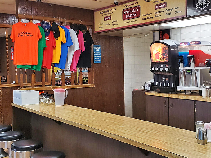 The service counter stands ready for action, where donut dreams become delicious reality with every order.