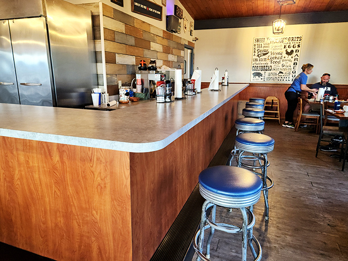 Classic diner counter with chrome stools&mdash;where solo diners become regulars and servers remember your order before you sit down.
