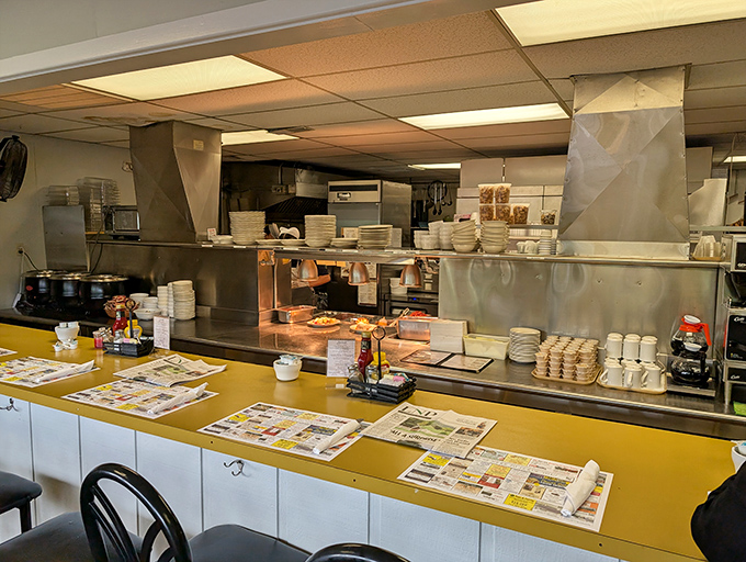 The pass-through counter—where orders are called, newspapers are read, and the daily rhythm of diner life plays out like a well-rehearsed symphony.