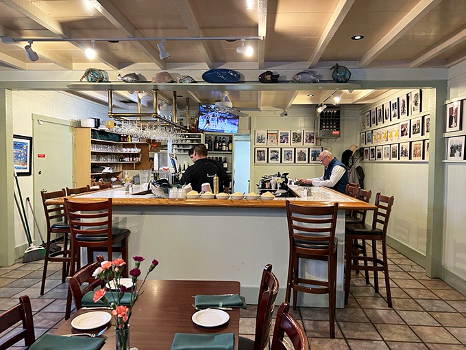 At the bar, where framed photos line the walls, regulars perch like seabirds, waiting for their next delicious catch.