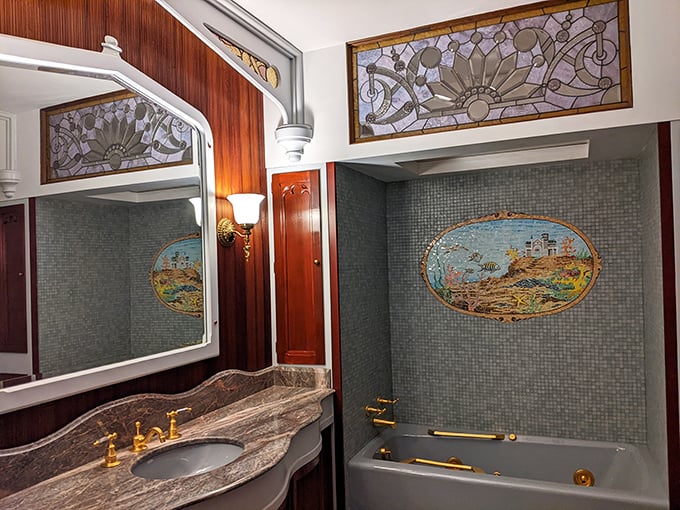 Even Victorian bathrooms had style. This elegant washroom with stained glass and mosaic tile makes our modern facilities look positively pedestrian.