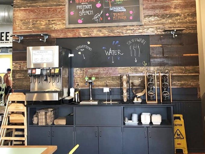 Rustic wood paneling meets modern beverage station&mdash;where even the water dispenser gets special treatment with hand-drawn signage.