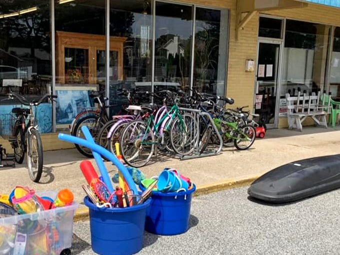 Beach cruisers and buckets of summer fun line the entrance&mdash;because nothing says "coastal living" like a secondhand bike with character.