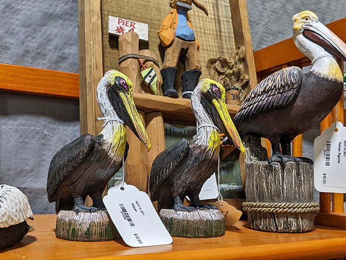 Pelican sculptures stand at attention, ready to migrate to your coastal-themed guest bathroom. Florida d&eacute;cor at its finest.