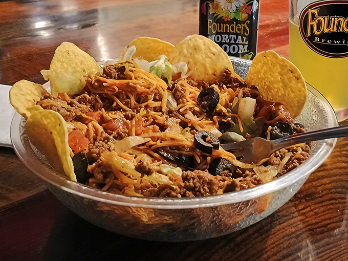 A nacho mountain worth climbing. That fork is attempting what many have tried&mdash;conquering this delicious terrain in one sitting.