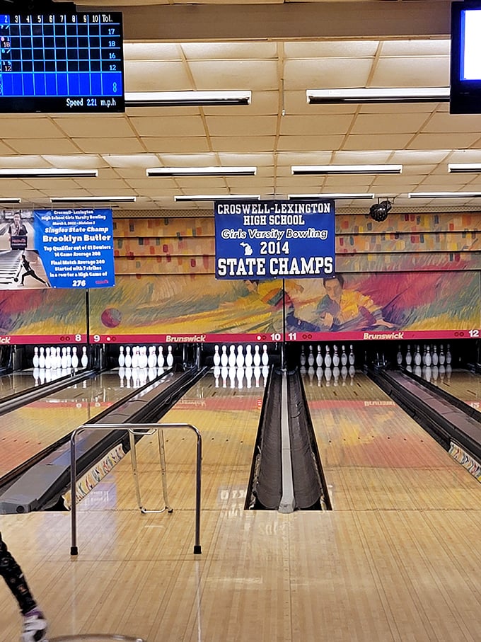Local pride shines bright at the bowling alley, where state championship banners remind visitors that small towns produce big victories.