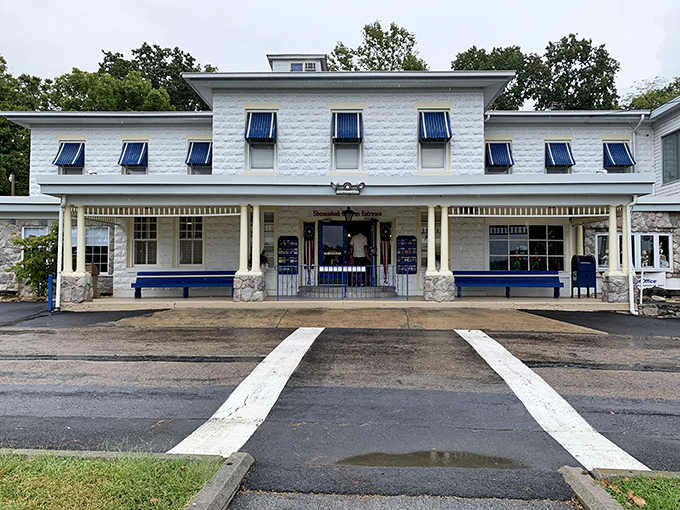 The charming 1920s-style visitor center welcomes explorers before they venture underground, a quaint prelude to the ancient wonders below.