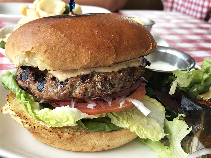 Between two seas of seafood options sits this harbor of comfort&mdash;a burger that reminds you they excel at everything that touches their grill.