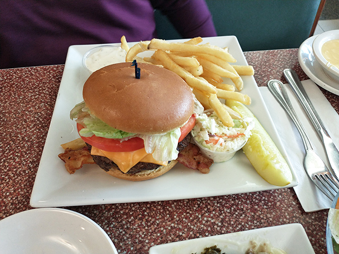 The classic American burger, where beef meets cheese in perfect harmony. Those fries aren't a side&mdash;they're essential supporting characters.