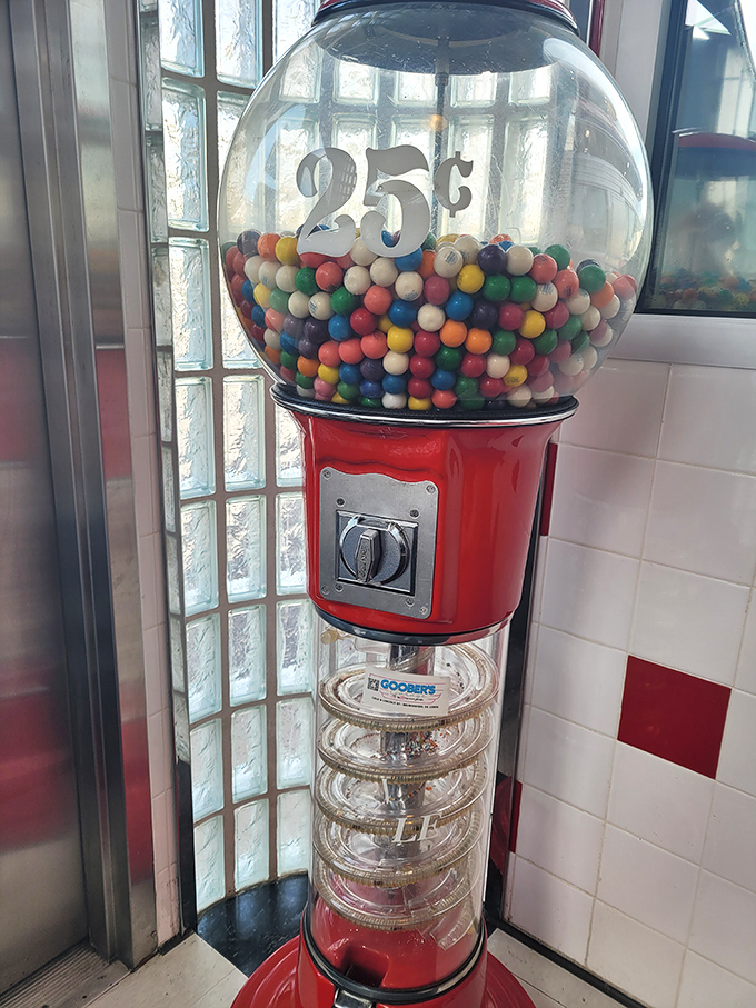 A quarter and a dream! This vintage gumball machine stands ready to reward patient diners with a colorful, sweet finale.