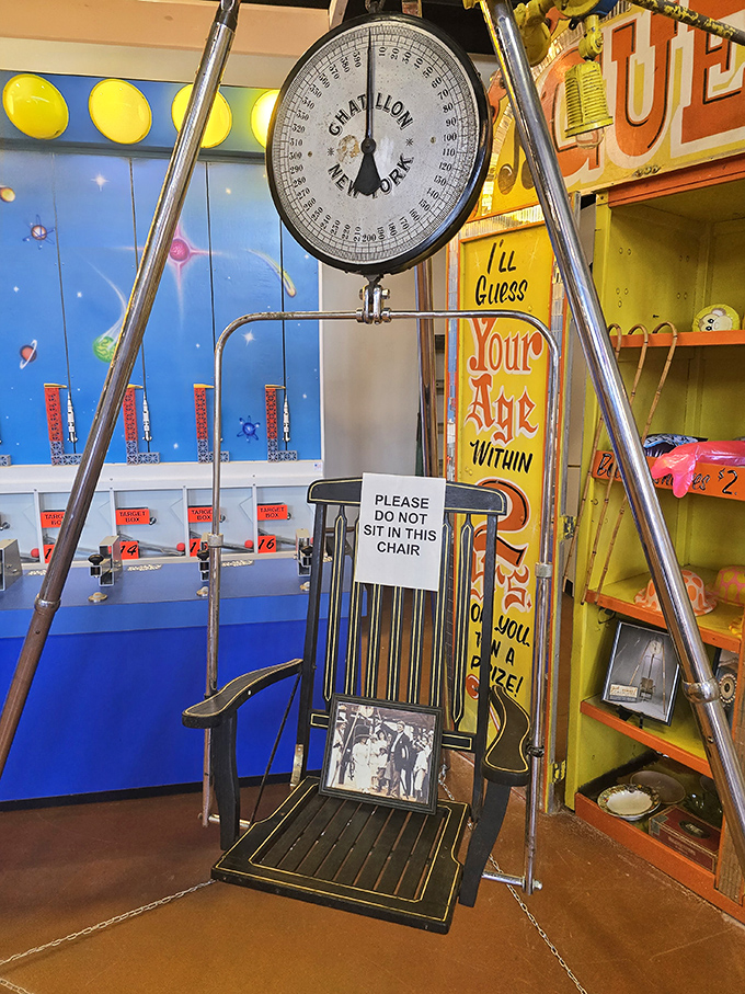 The "guess your weight" chair represents carnival games where skill mattered less than the joy of playing.