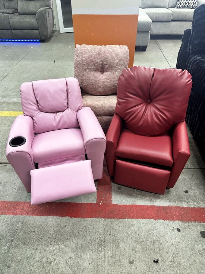 The pink and burgundy recliners face off in a comfort competition&mdash;each one silently arguing it deserves the prime spot in your living room.