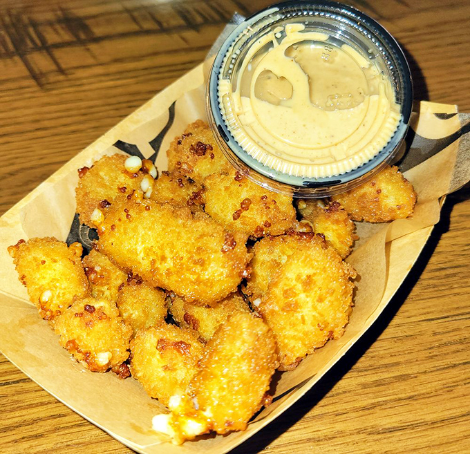 Golden-fried cheese curds that squeak between your teeth&mdash;the appetizer equivalent of a warm hug. Dipping sauce not optional.