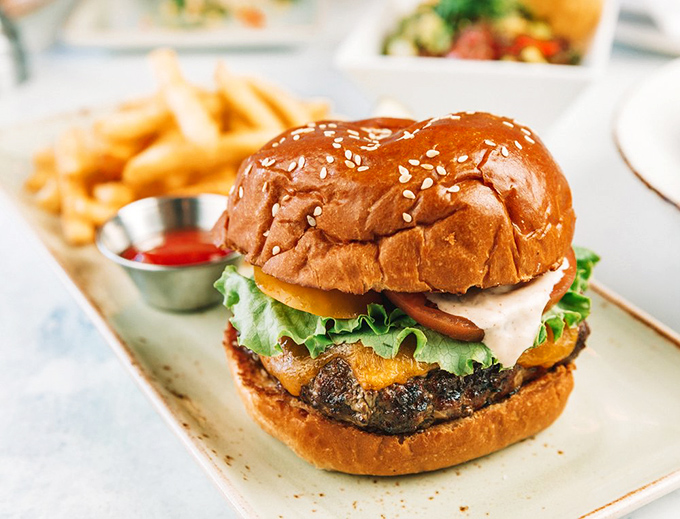 A burger that makes you forget you came for seafood&mdash;nestled in a brioche bun with the confidence of something that knows it belongs.