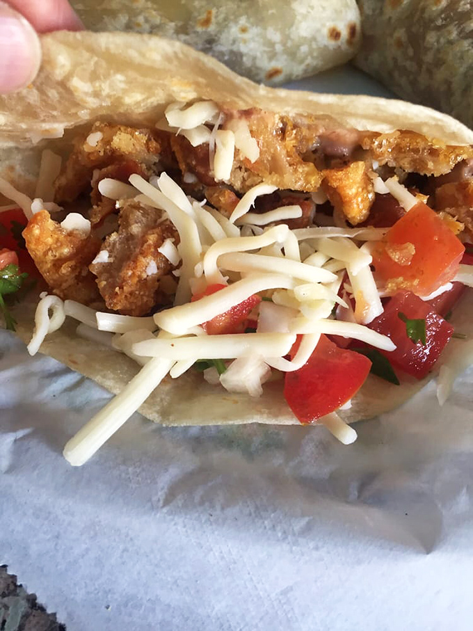 A chicharron taco that delivers the textural trifecta: crispy exterior, tender meat, and that perfect tortilla chew.