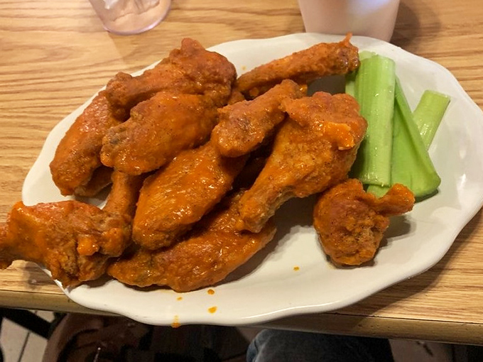 Buffalo wings with attitude&mdash;vibrant orange sauce clinging to crispy skin, leaving behind that telltale tingle only proper wing sauce can deliver. 