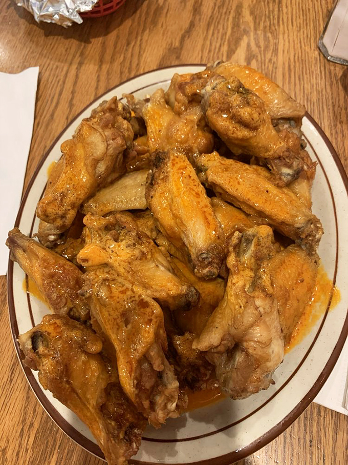 These wings aren't messing around. Meaty, sauce-slicked, and piled high&mdash;this is why napkins were invented, folks.