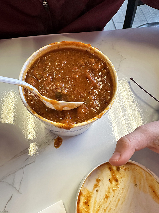 A hearty bowl of what looks like homemade chili—the kind that makes you want to befriend winter instead of complaining about it.