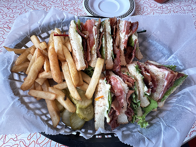 The club sandwich&mdash;three layers of nostalgia between toasted bread. Served with enough fries to share, though you probably won't want to.