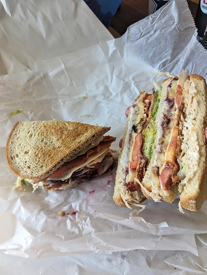 The club sandwich – where bread, meat, and veggies stack up like geological layers of deliciousness. Archaeology never tasted so good.