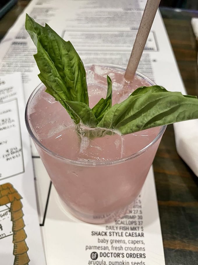 This isn't just a cocktail—it's a garden in a glass, where fresh basil leaves turn an ordinary drink into a sensory experience.
