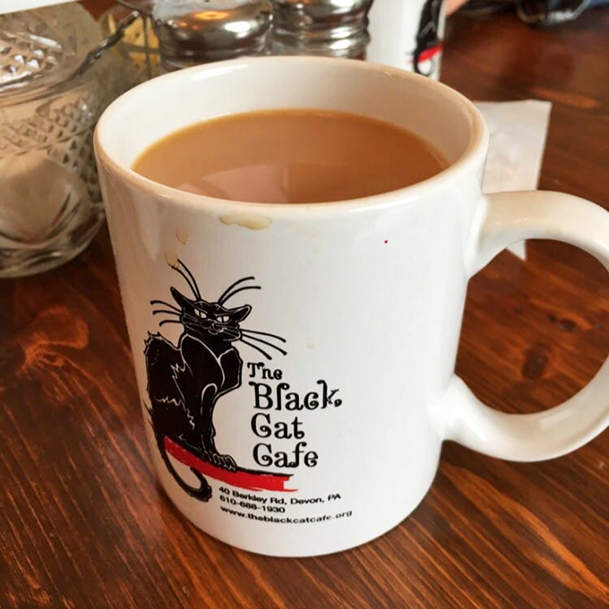 Even their coffee mugs have personality &ndash; featuring the cafe's namesake feline looking as satisfied as you'll feel after your meal.