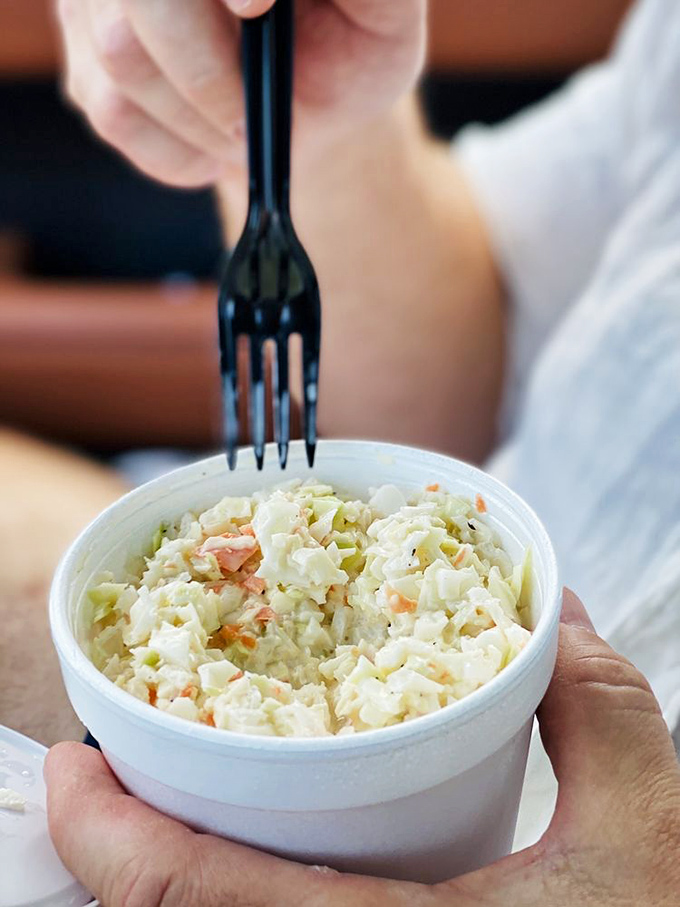 Coleslaw this fresh deserves more respect than being called a "side." It's the cool, crisp counterpoint that balances every bite of fried seafood perfection. 