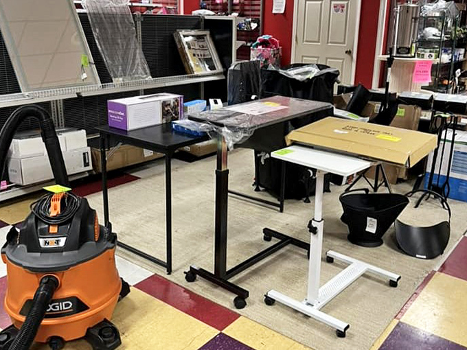 Home office heaven awaits with adjustable desks and that industrial-chic orange vacuum that says, "I'm practical, but make it fashion." 