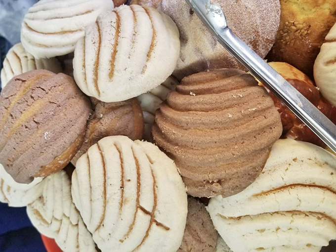 These conchas huddle together like old friends, their distinctive ridged tops the signature fashion statement of Mexican bakeries everywhere.