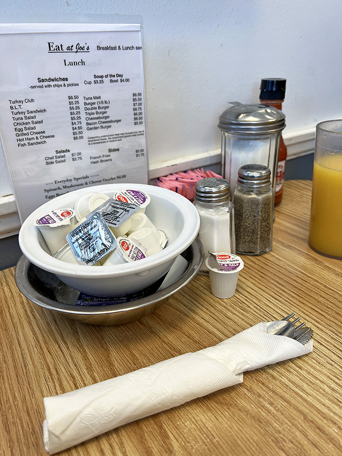 The table setting&mdash;a still life painting titled "Anticipation," featuring the supporting cast of salt, pepper, and sweetener packets.