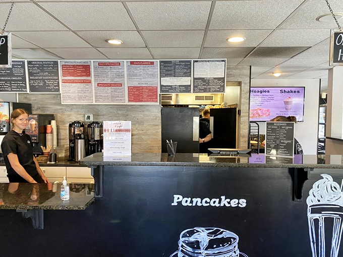 Behind this counter, breakfast dreams come true. The "Pancakes" sign isn't just decoration&mdash;it's a delicious promise.