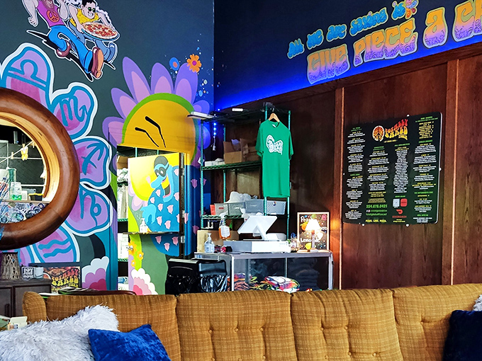 Every corner reveals another artistic surprise, from sunshine motifs to flower power designs that make waiting for your pizza an adventure.