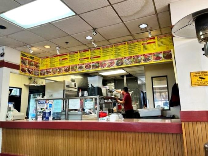 Where the magic happens. That menu board has witnessed thousands of "I'll have the usual" moments from loyal regulars.