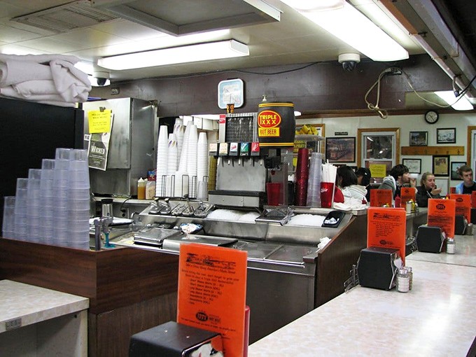 Behind this counter, short-order wizards perform culinary alchemy, transforming simple ingredients into the comfort food that haunts your dreams.