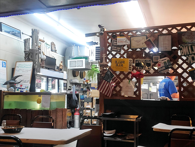 The heart of the operation, where magic happens behind wooden lattice. Those postcards and mementos tell stories of decades of satisfied customers.