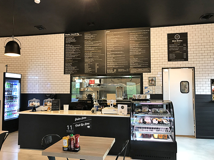 Where culinary magic happens: white subway tiles meet sleek black counters in a space that's both efficient and inviting.