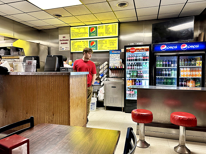 Behind the counter is where the magic happens, with menu boards overhead like culinary commandments handed down through generations.