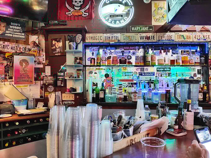 A bar that tells stories through its collection of bottles, stickers, and the patina that only comes from decades of good times.