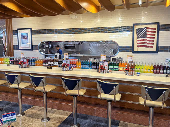 The counter where solo diners become regulars and soda fountains dispense liquid nostalgia alongside modern craft beverages.