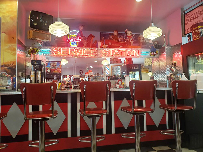 Pull up a red vinyl stool at the counter and watch short-order magic happen under the glow of "SERVICE STATION" neon.