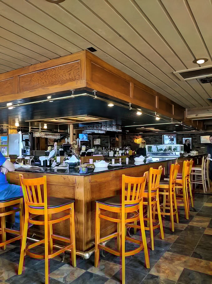 The bar at Smuggler's Cove&mdash;where seafood stories get taller and cocktails disappear faster than a submarine on radar.