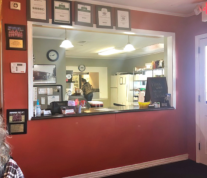 Awards on display aren't just for show—they're the receipts. That pass-through window is where seafood dreams become reality.